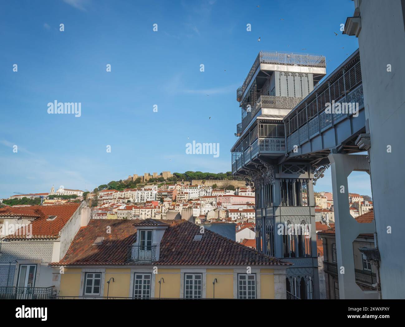 Santa Justa Lift and city view with Saint George Castle (Castelo de Sao ...