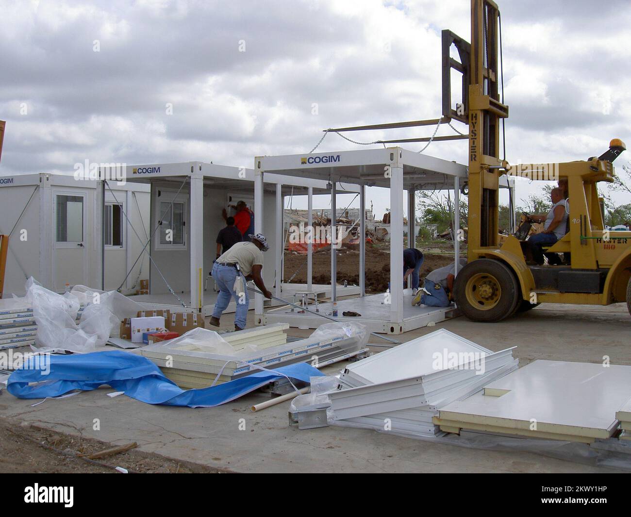 Workmen begin constructing living units in Kansas. Kansas Severe Storms ...