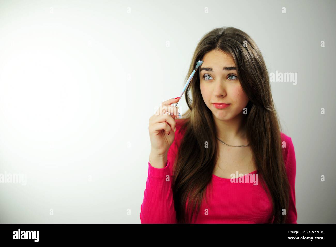 young woman girl playing pen in hand online learning reluctance to ...