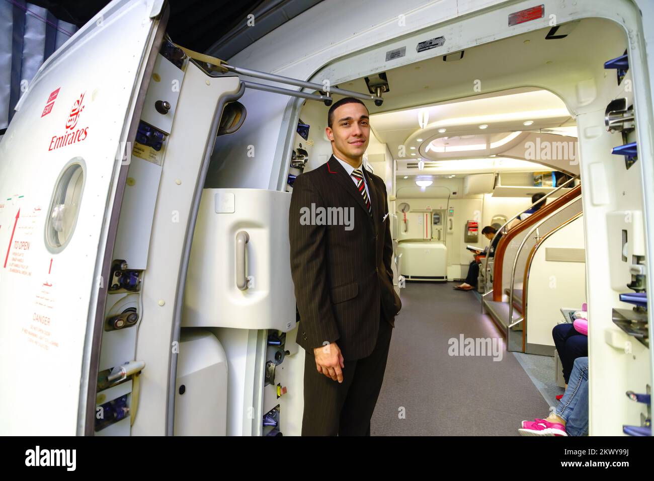 DUBAI - OCT 17: Emirates crew member meet passengers in Airbus A380 ...