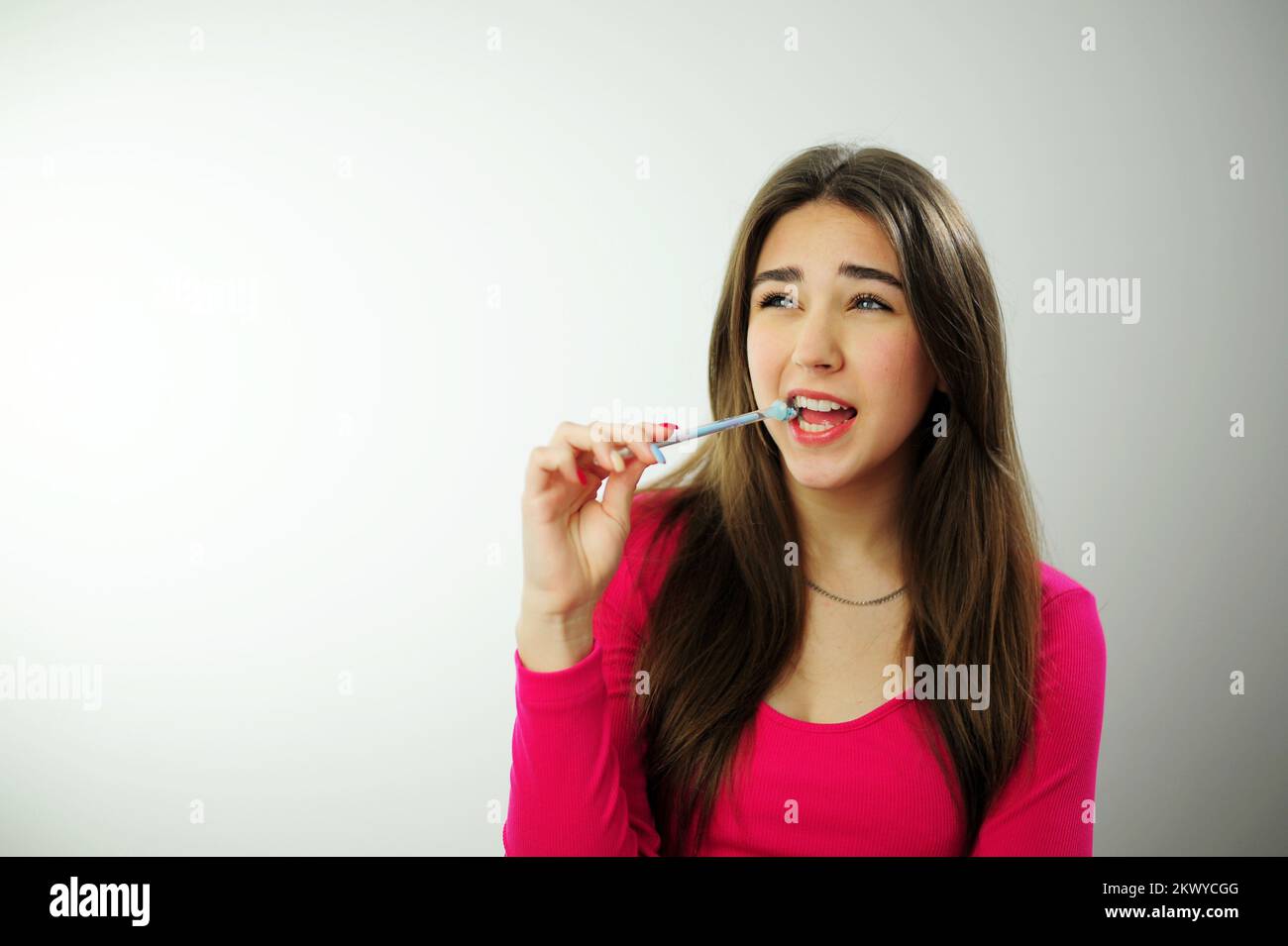 young woman girl playing pen in hand online learning reluctance to ...