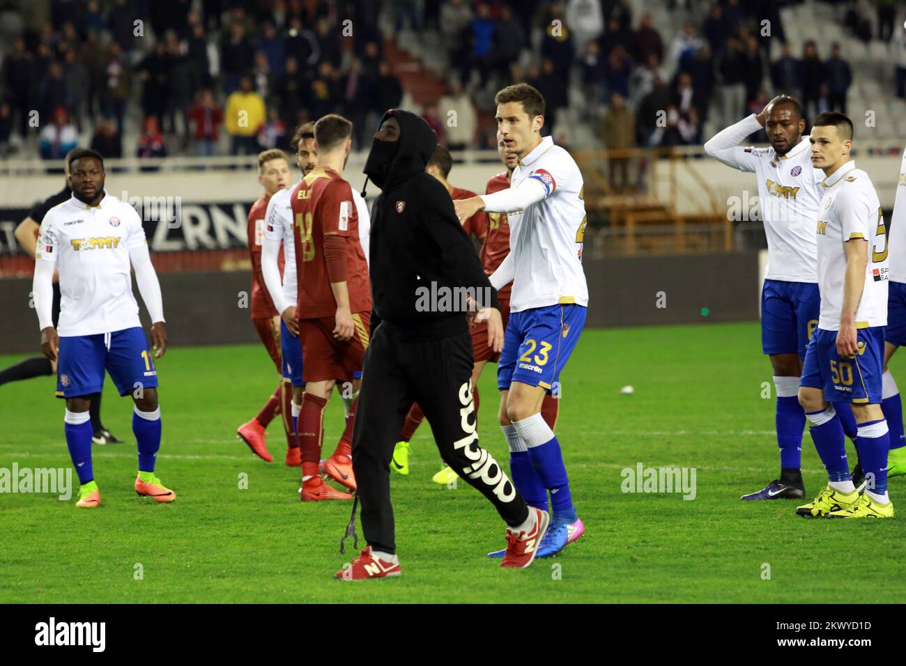 11.03.2017., Split, Croatia - Masked Hajduk fan ran on the field with a ...