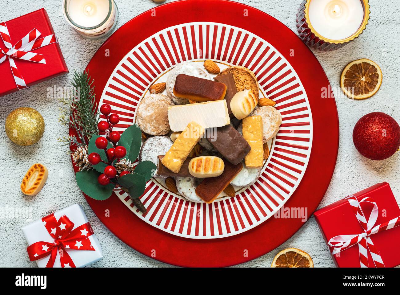 Top view of Nougat christmas sweet,mantecados and polvorones on a plate ...