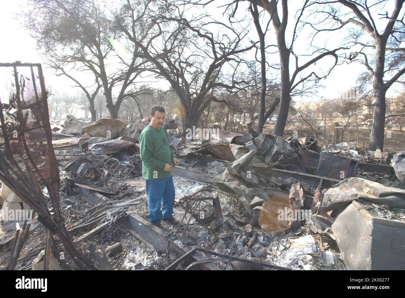 Wildfires, Ramona, CA, November 9, 2007 Art Garcia views the remains of ...