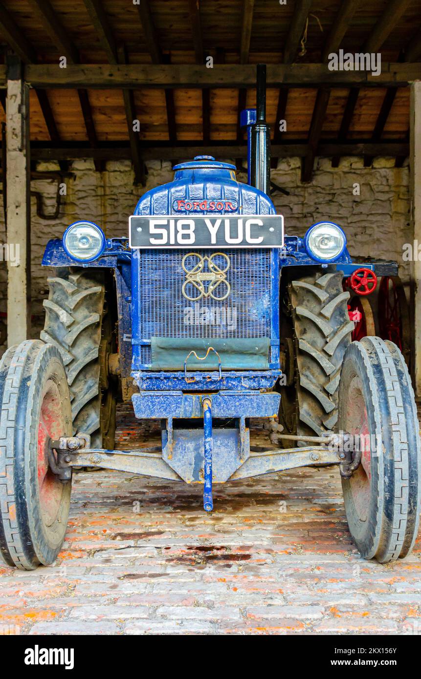 Blue 1920's tracor stored in aold shed Stock Photo - Alamy