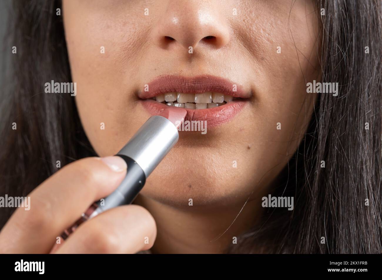 Rouging Her Lips Close Up Front View Of Woman Rouging Her Lips
