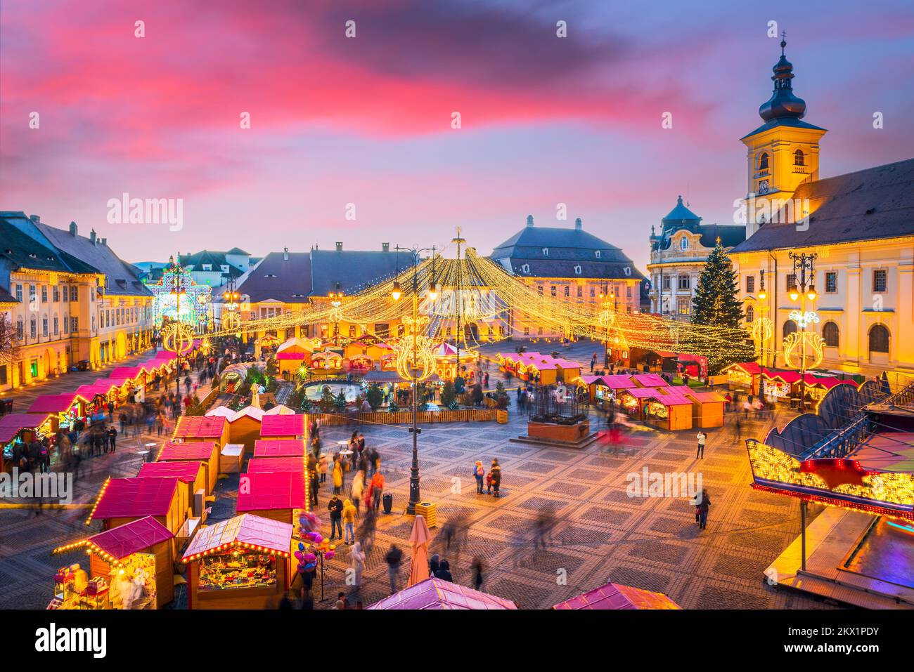 Sibiu, Romania - December 2014: Night image with tourists at Sibiu ...