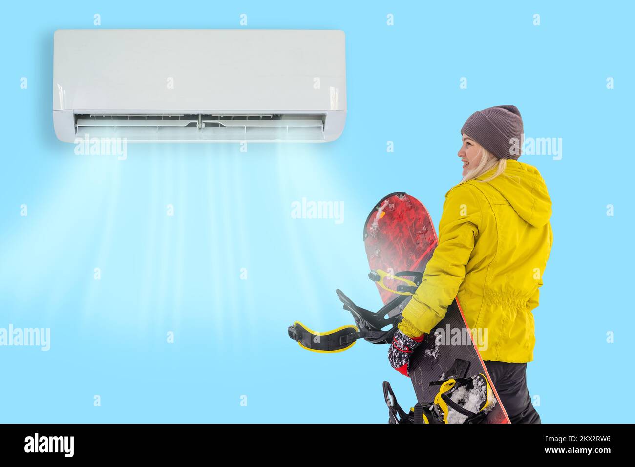 Woman under the air conditioner Stock Photo - Alamy