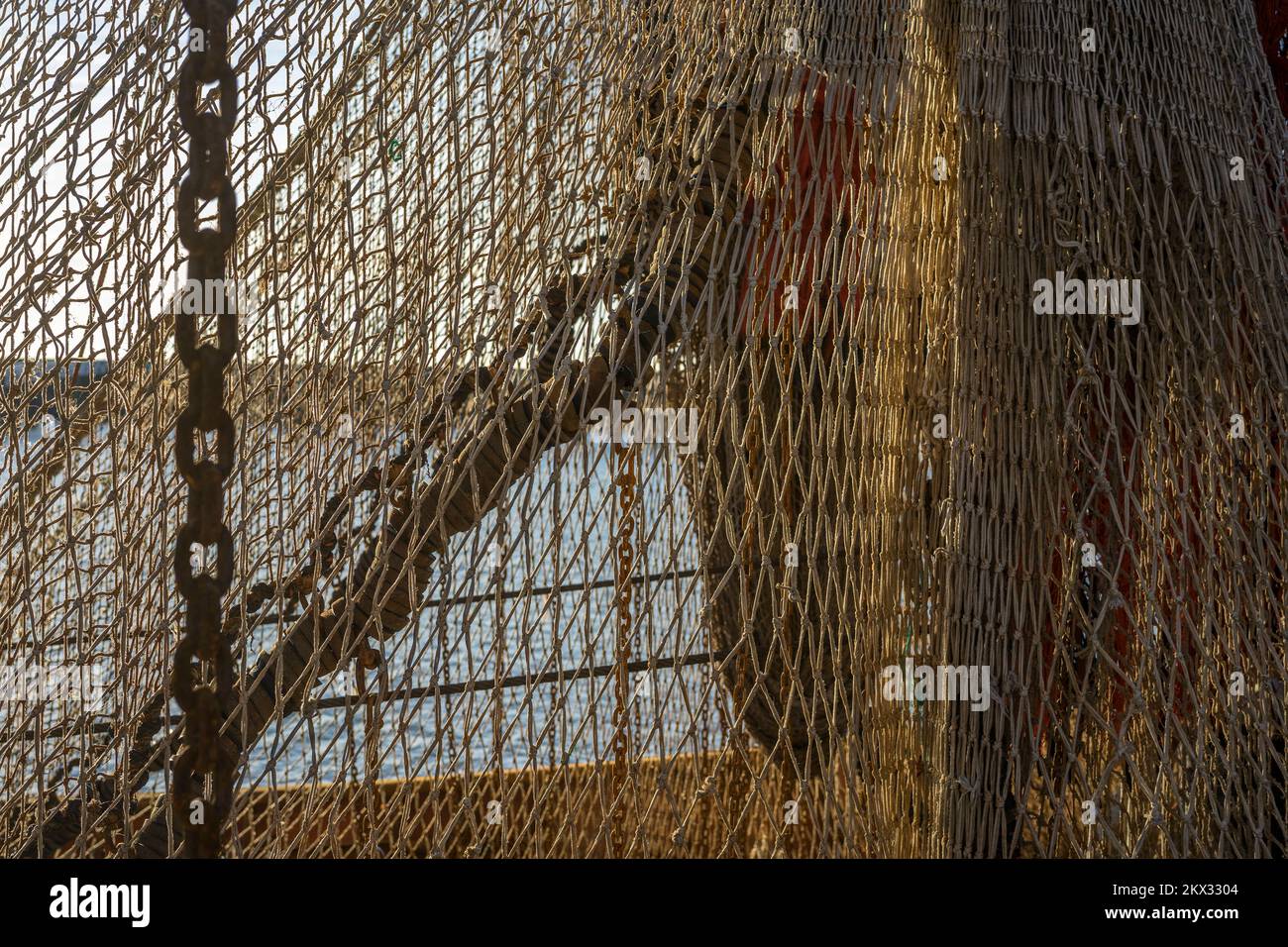 Fishing nets hanging on a fishing boat in the port of Harlingen ...
