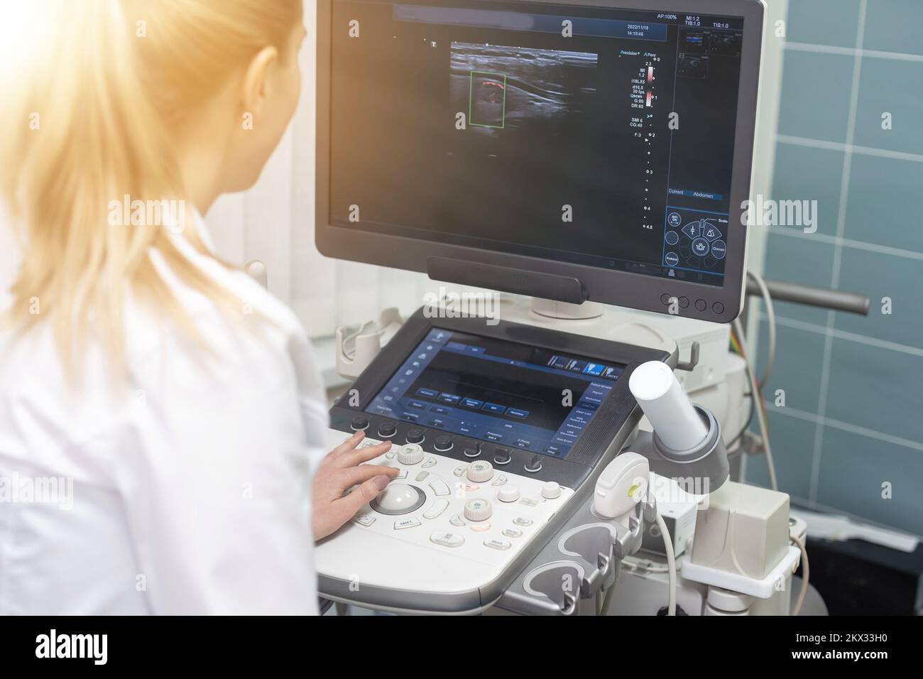 Woman Endocrinologist Making Ultrasonography To A Female Patient In An