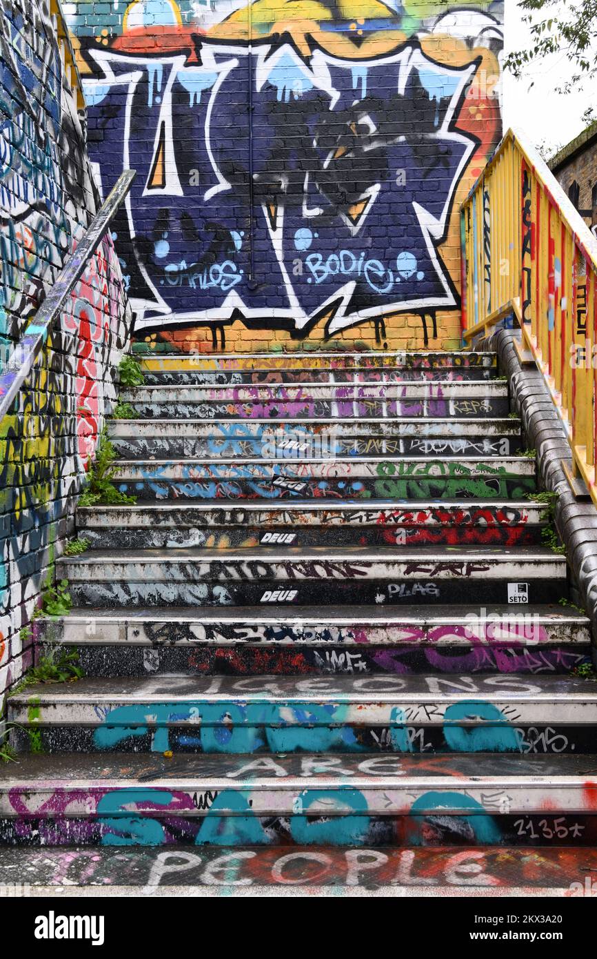 Graffiti painted steps on footbridge leading from Cheshire Street to ...