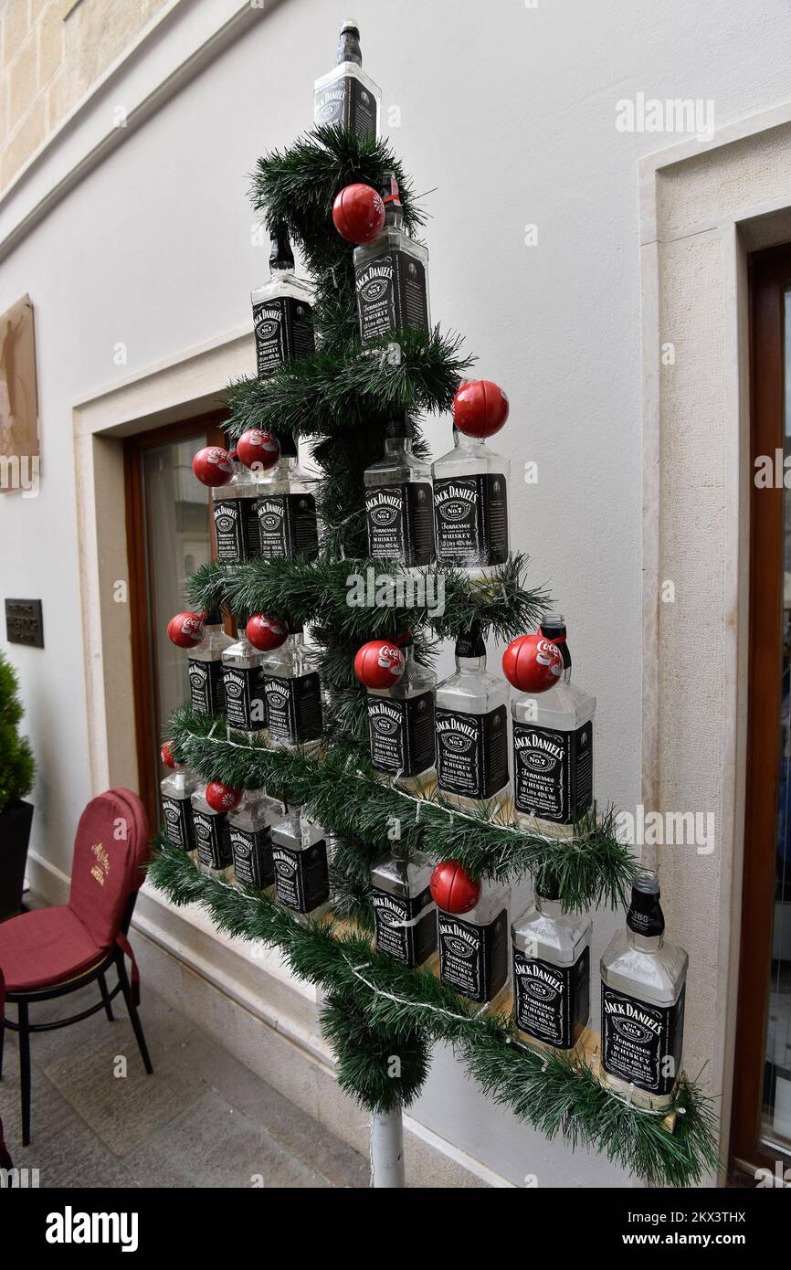 16.12.2017., Pula, Croatia - Christmas tree with Jack Daniels bottles ...