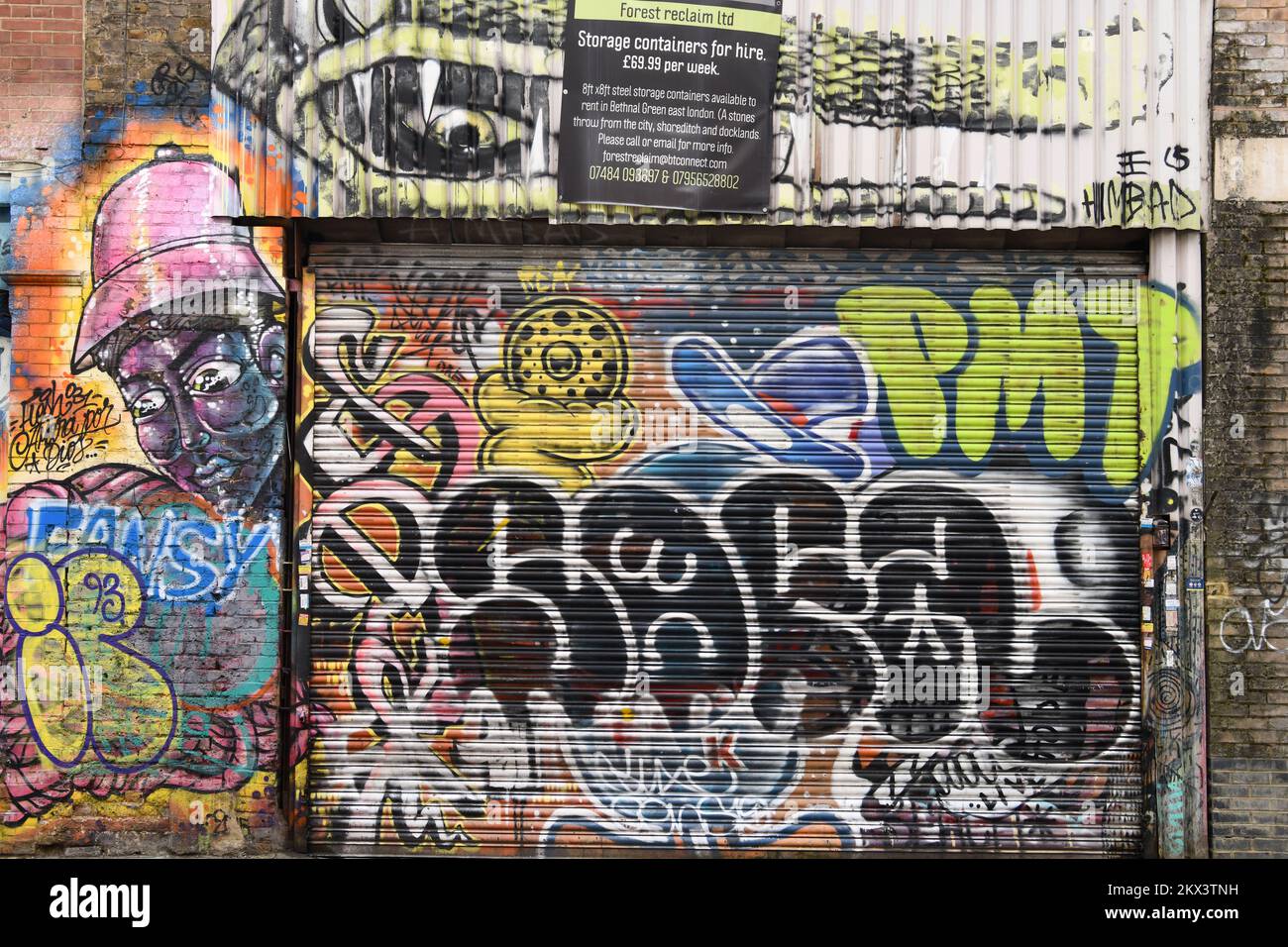 graffiti and street art on shutters in Shoreditch London Stock Photo ...