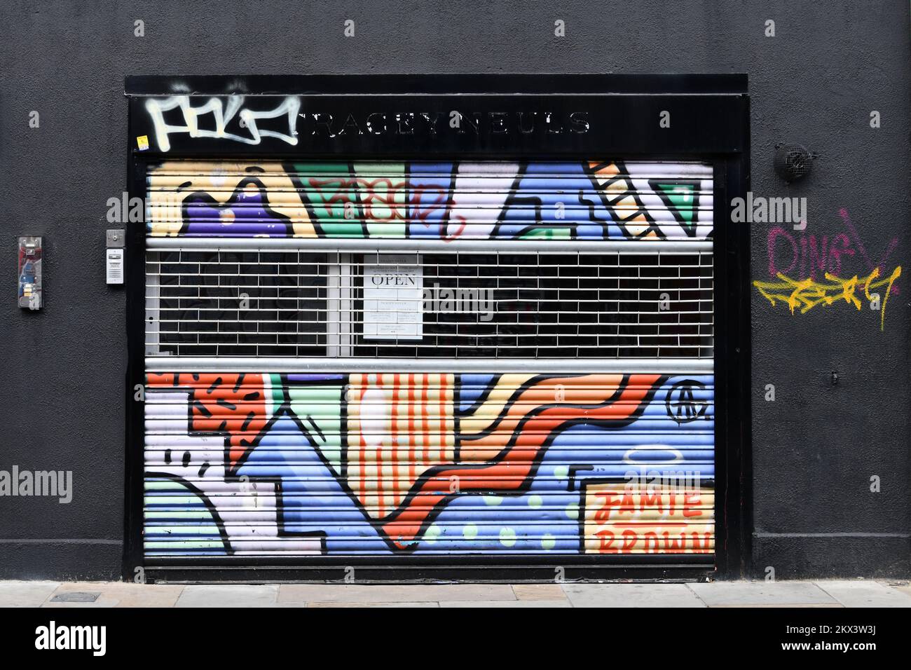 graffiti and street art on shutters in Shoreditch London Stock Photo ...