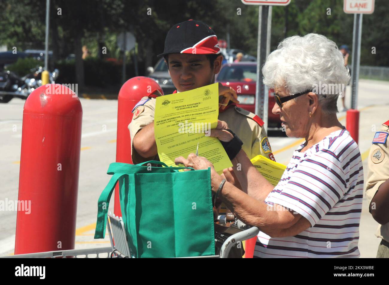 Boy Scouts hand out FEMA Disaster Information.. Photographs Relating to ...