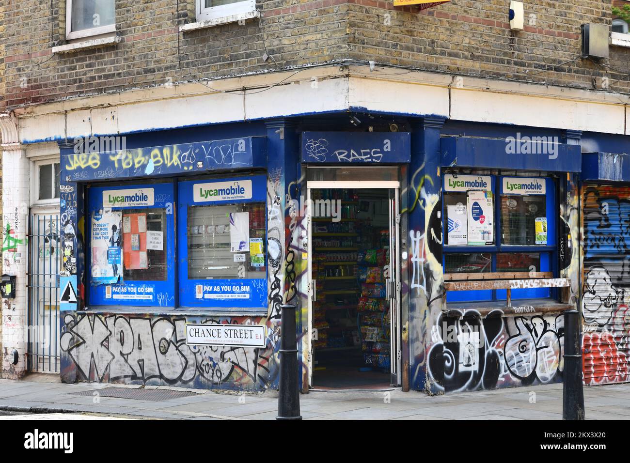 Corner shop covered in graffiti on junction of Chance Street and Old ...