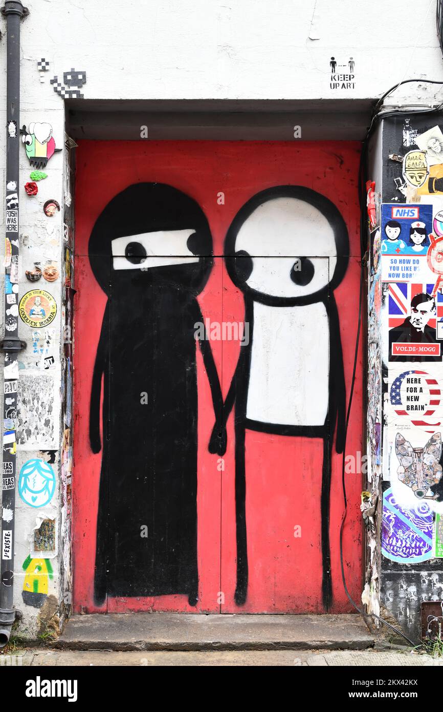 Red doorway with black and white stick figures hi-res stock photography ...