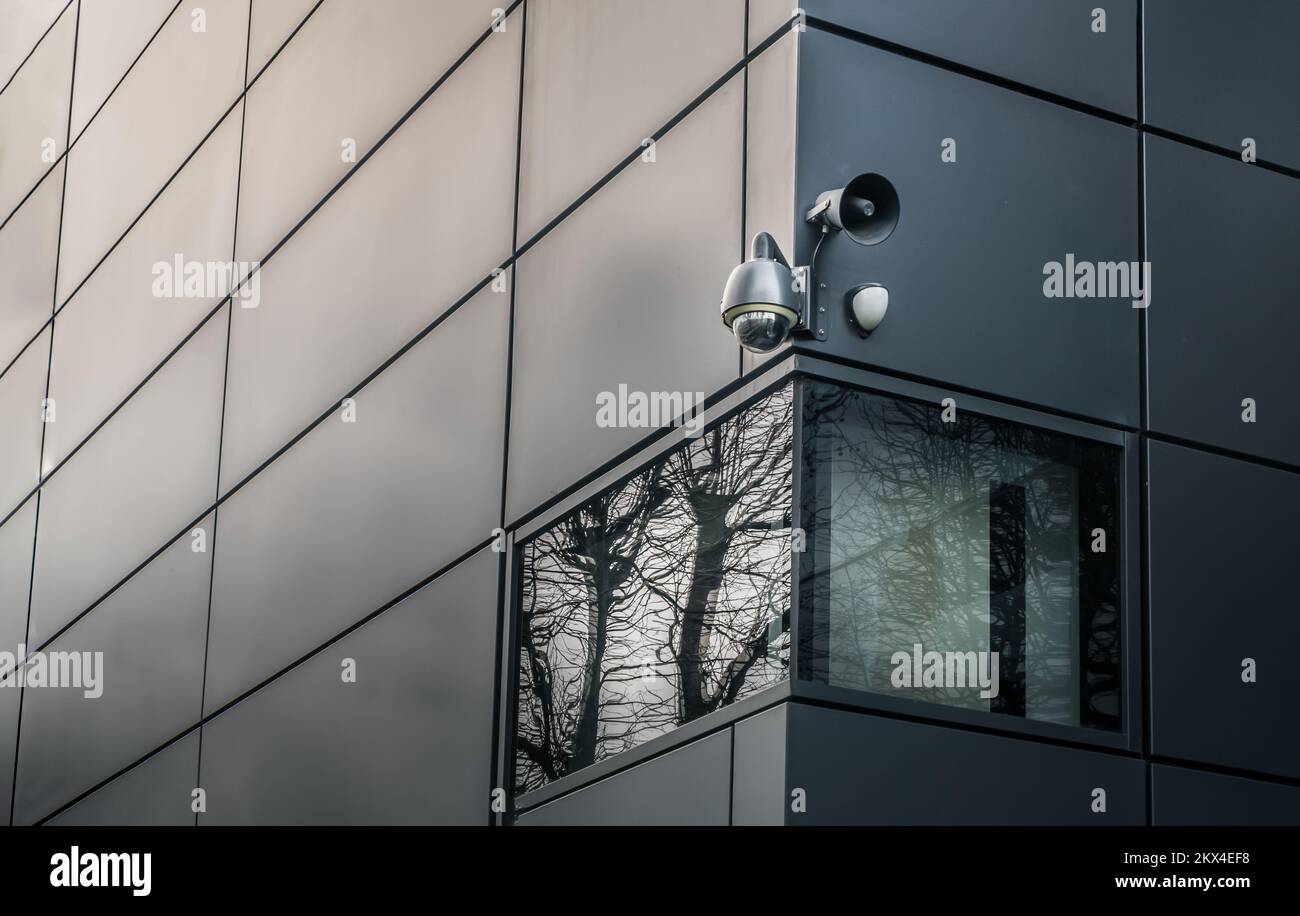 Security camera or CCTV is outsite on the wall of the modern building ...