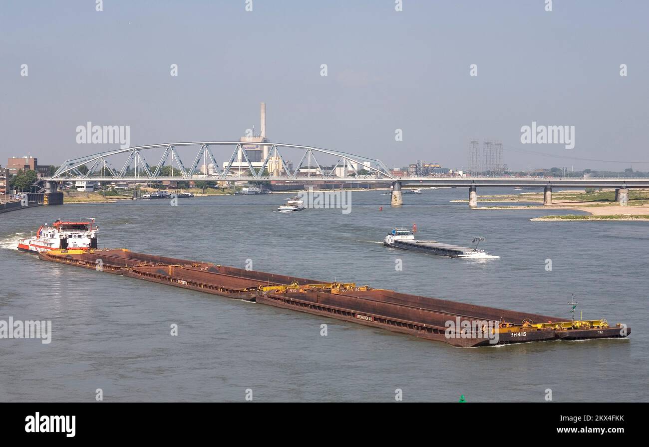 Pusher boat sailing the river Waal near Nijmegen in the Netherlands ...