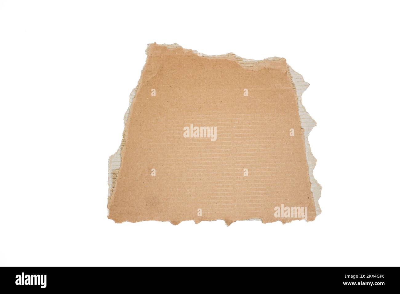 Cardboard piece isolated on white background. Top view of torn ...