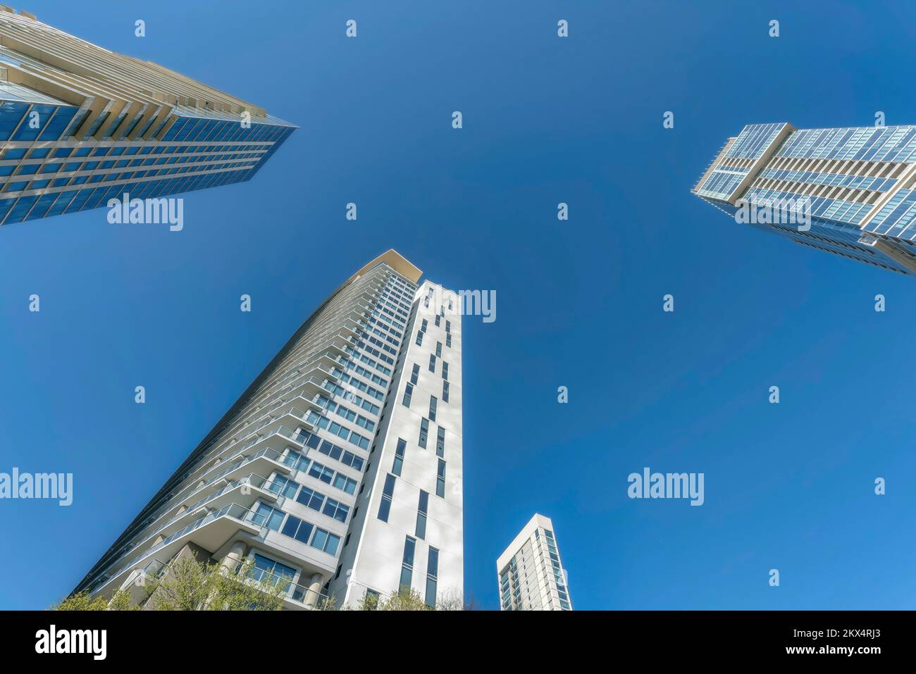 Exterior of modern apartments and condiminiums with blue sky background ...