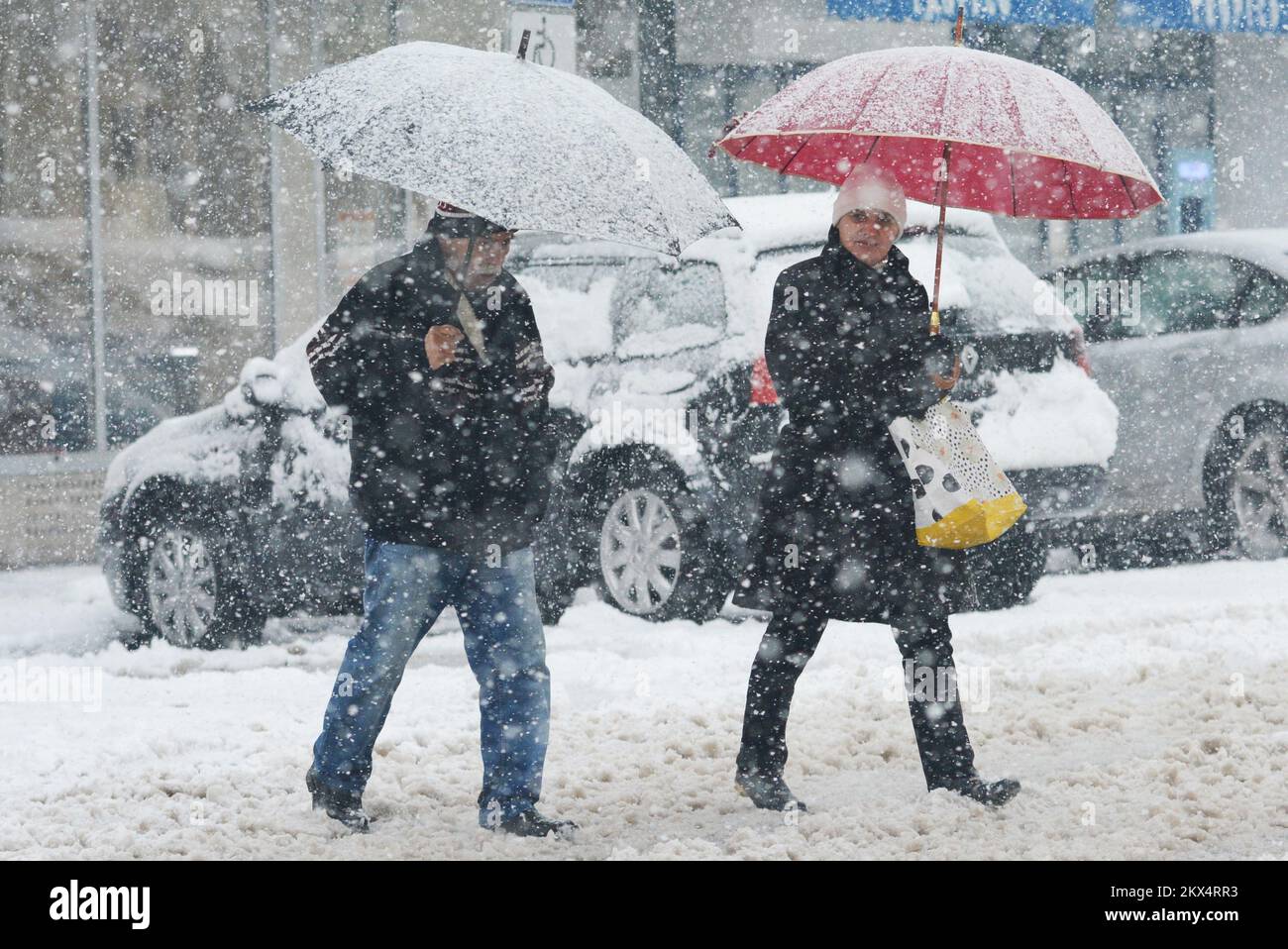 People walks during heavy snow storm in Sisak, Croatia on February 03 ...