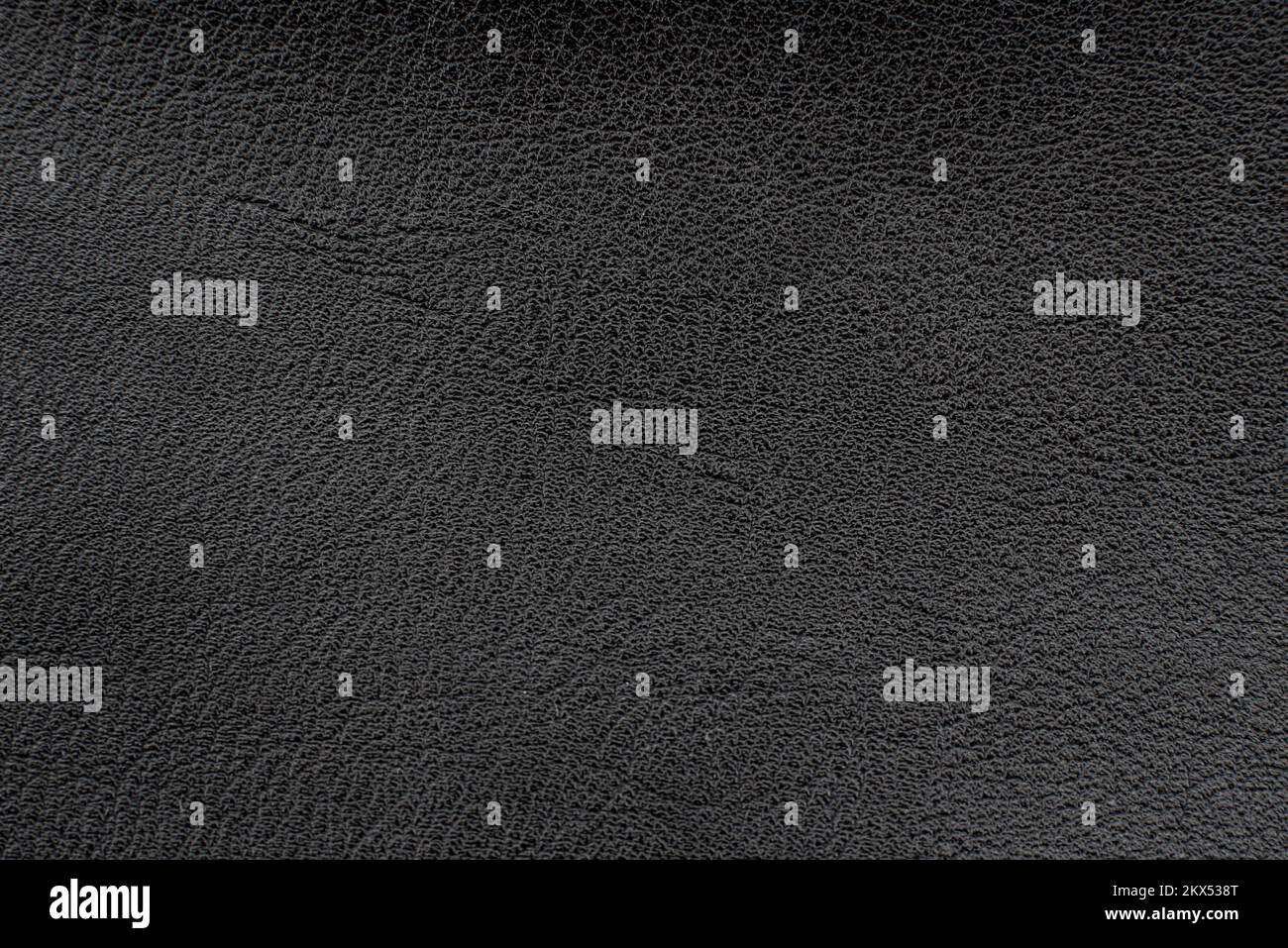 Black leather texture. Abstract background of dark leather with small ...