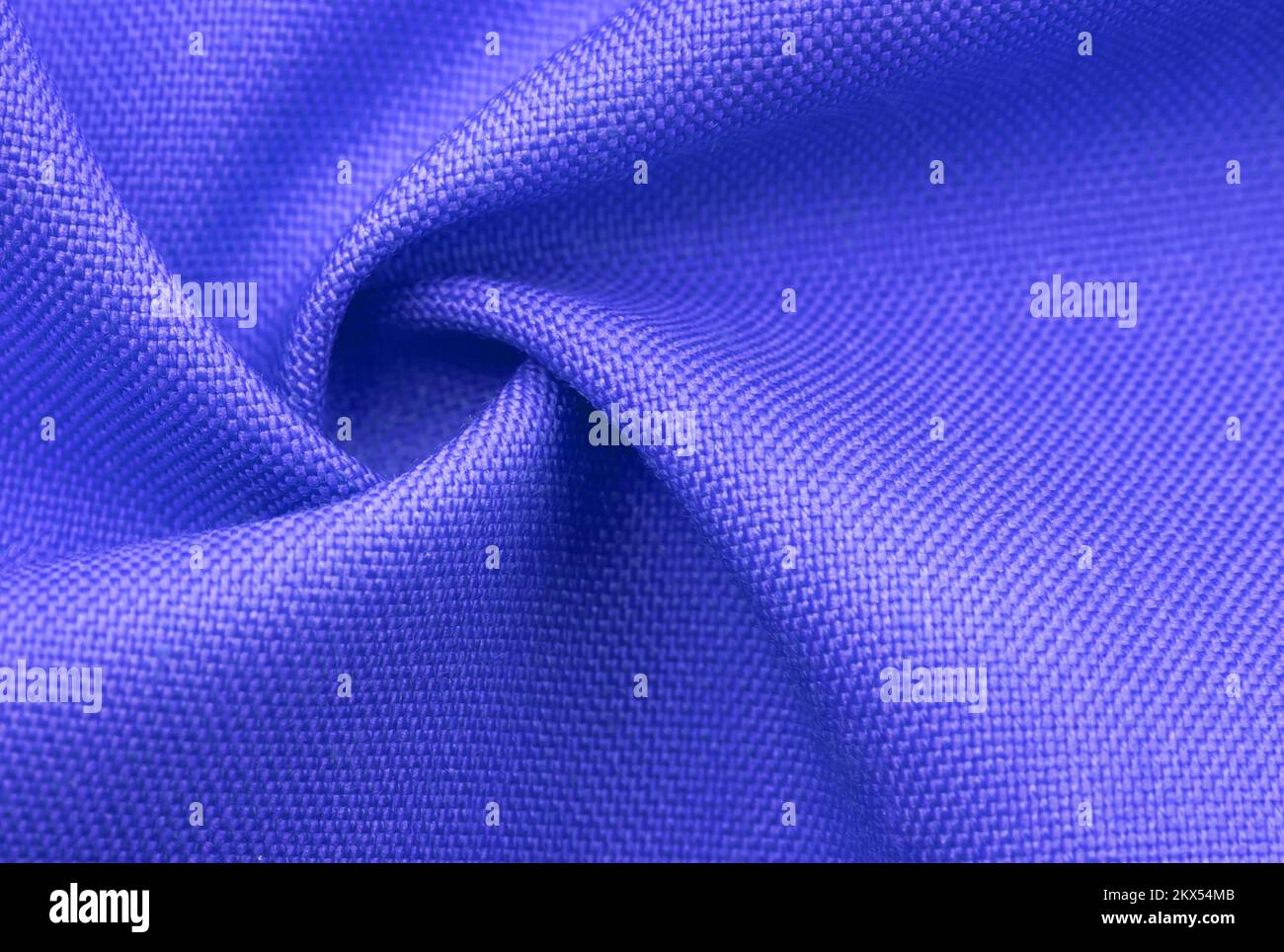 Blue fabric background with folds and waves. Textile. Material. Texture ...