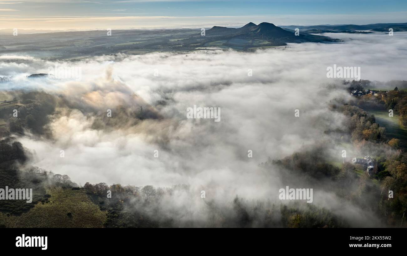 Aerial view of a cloud inversion around the Eildons and the River Tweed ...