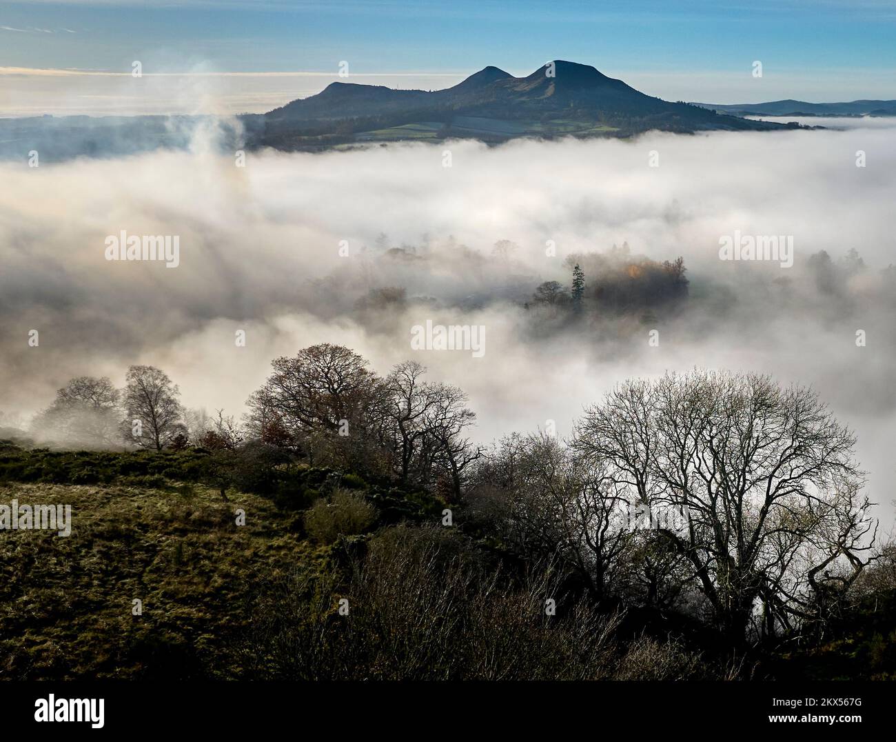 Aerial view of a cloud inversion around the Eildons and the River Tweed ...