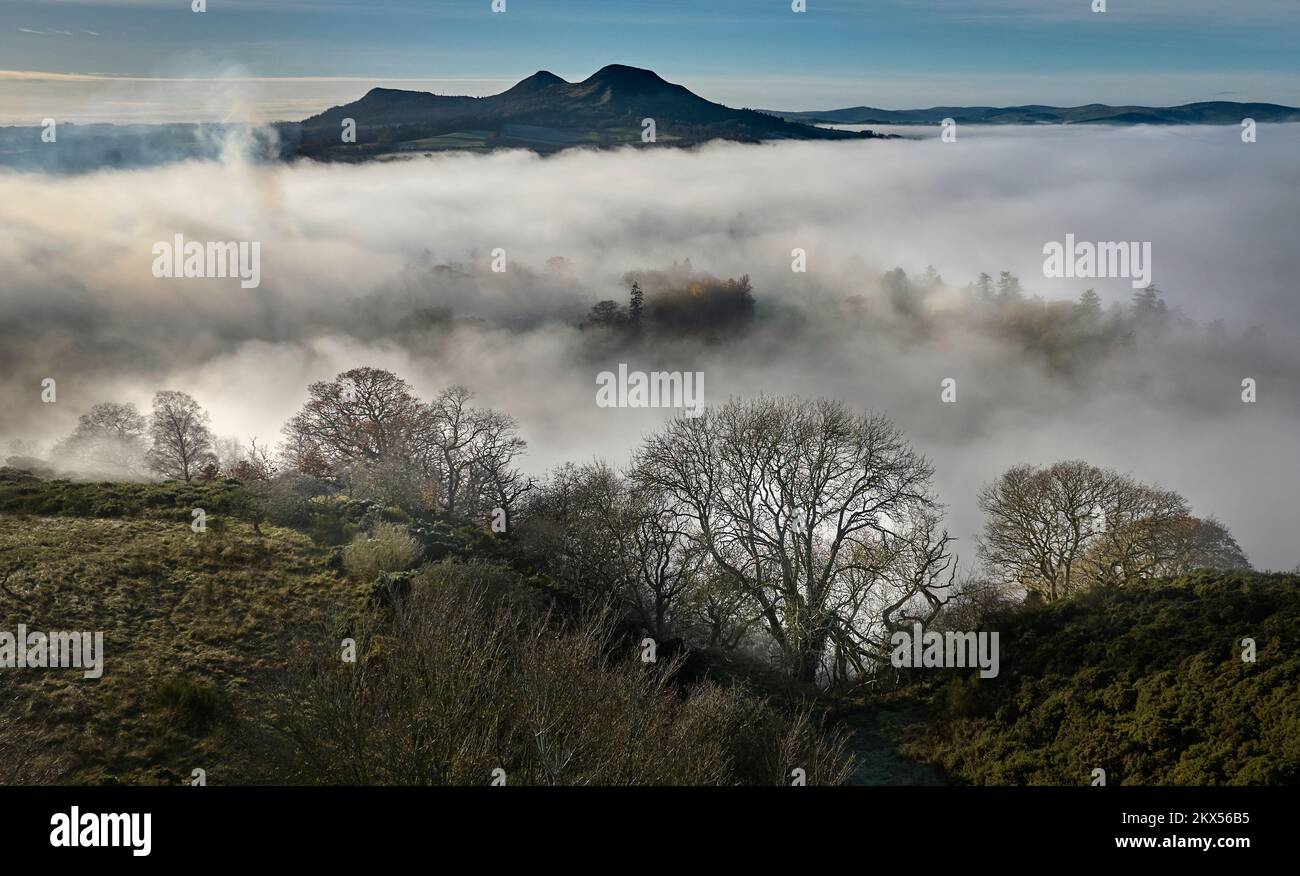 Aerial view of a cloud inversion around the Eildons and the River Tweed ...