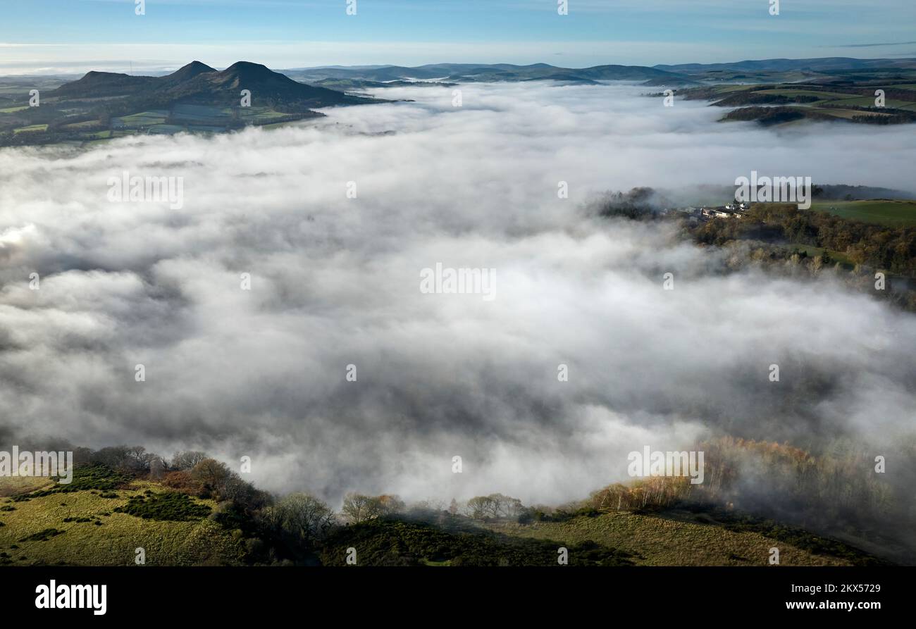 Aerial view of a cloud inversion around the Eildons and the River Tweed ...