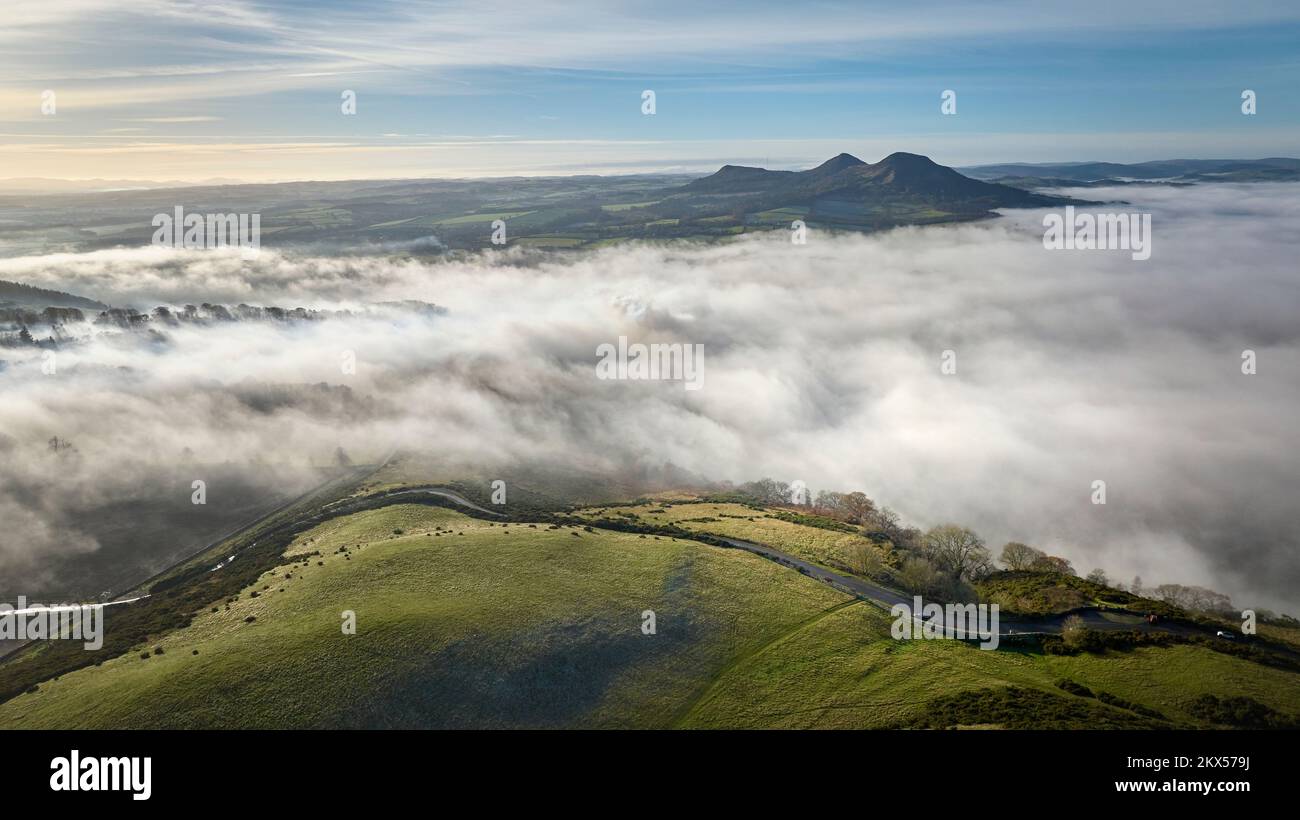 Aerial view of a cloud inversion around the Eildons and the River Tweed ...