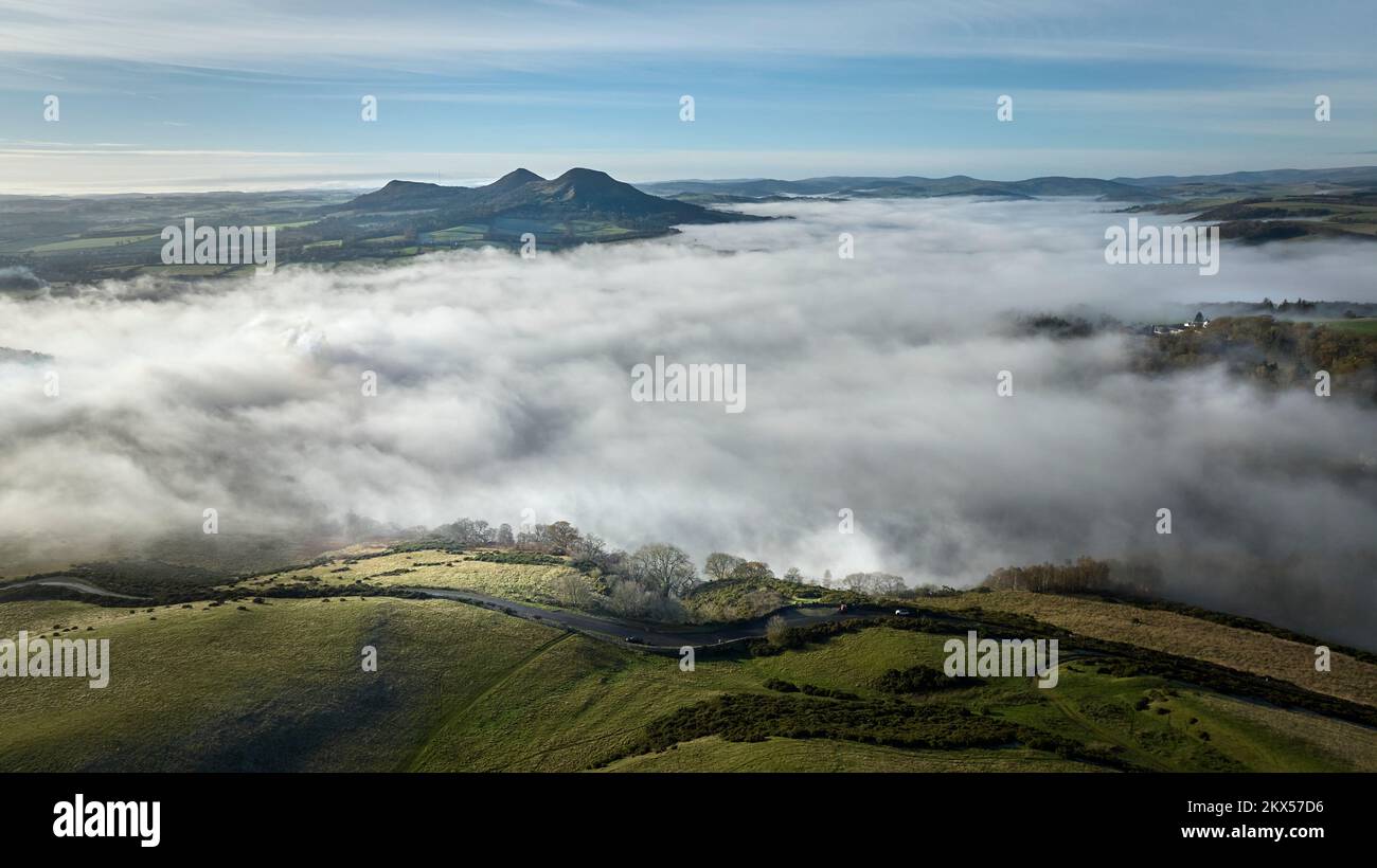Aerial view of a cloud inversion around the Eildons and the River Tweed ...