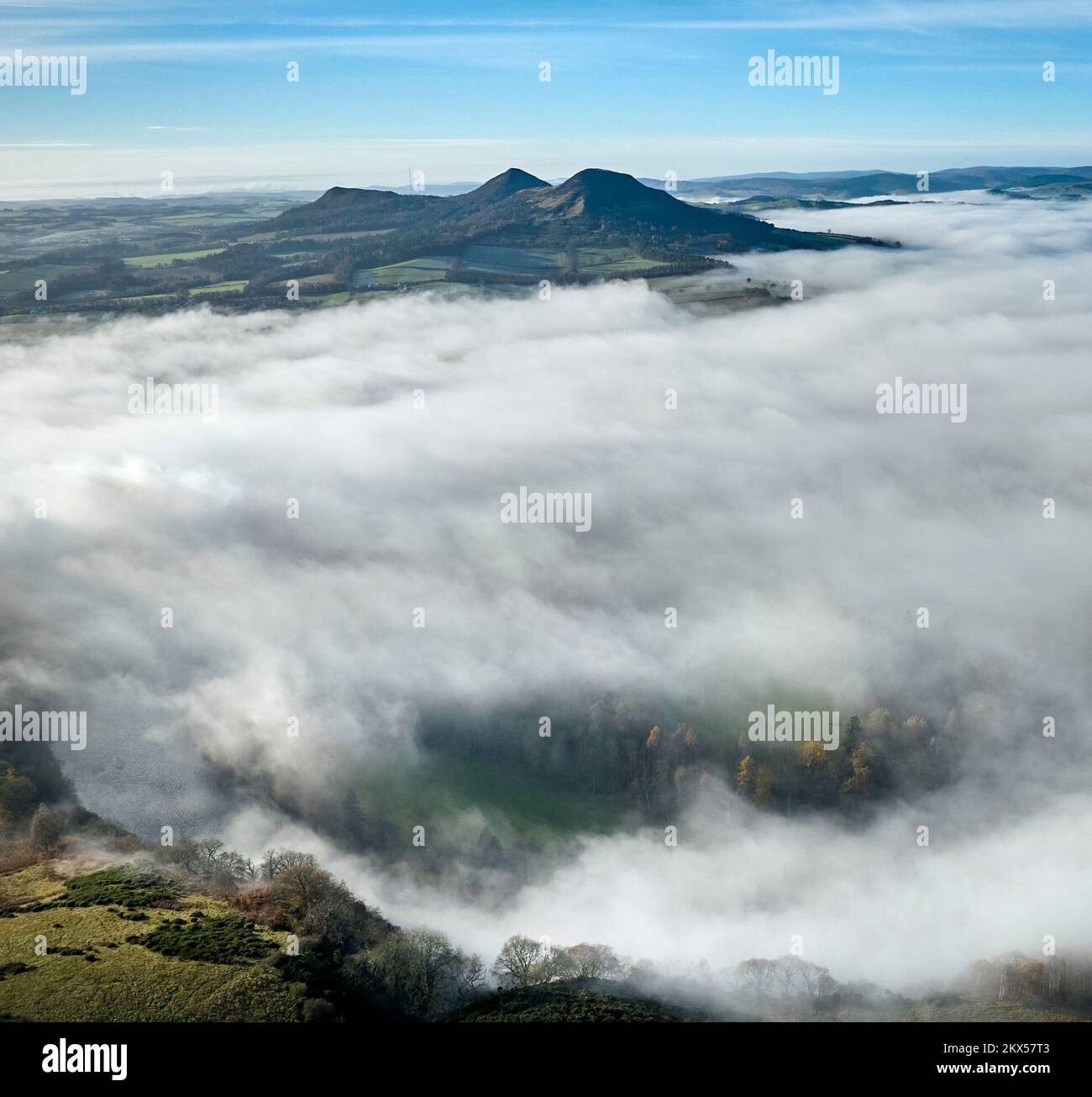 Aerial view of a cloud inversion around the Eildons and the River Tweed ...