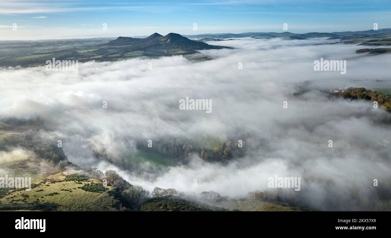 Aerial view of a cloud inversion around the Eildons and the River Tweed ...