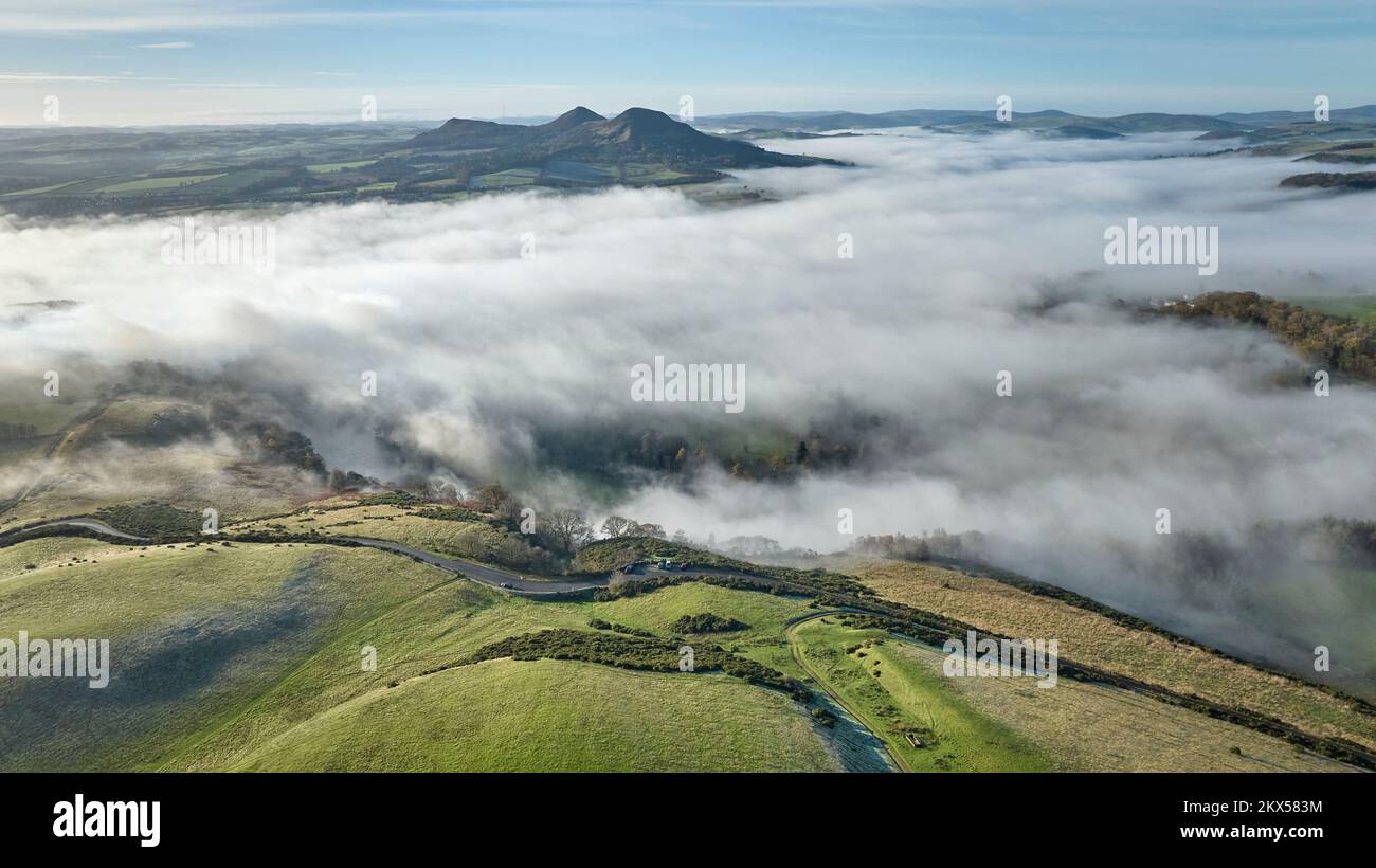 Aerial view of a cloud inversion around the Eildons and the River Tweed ...