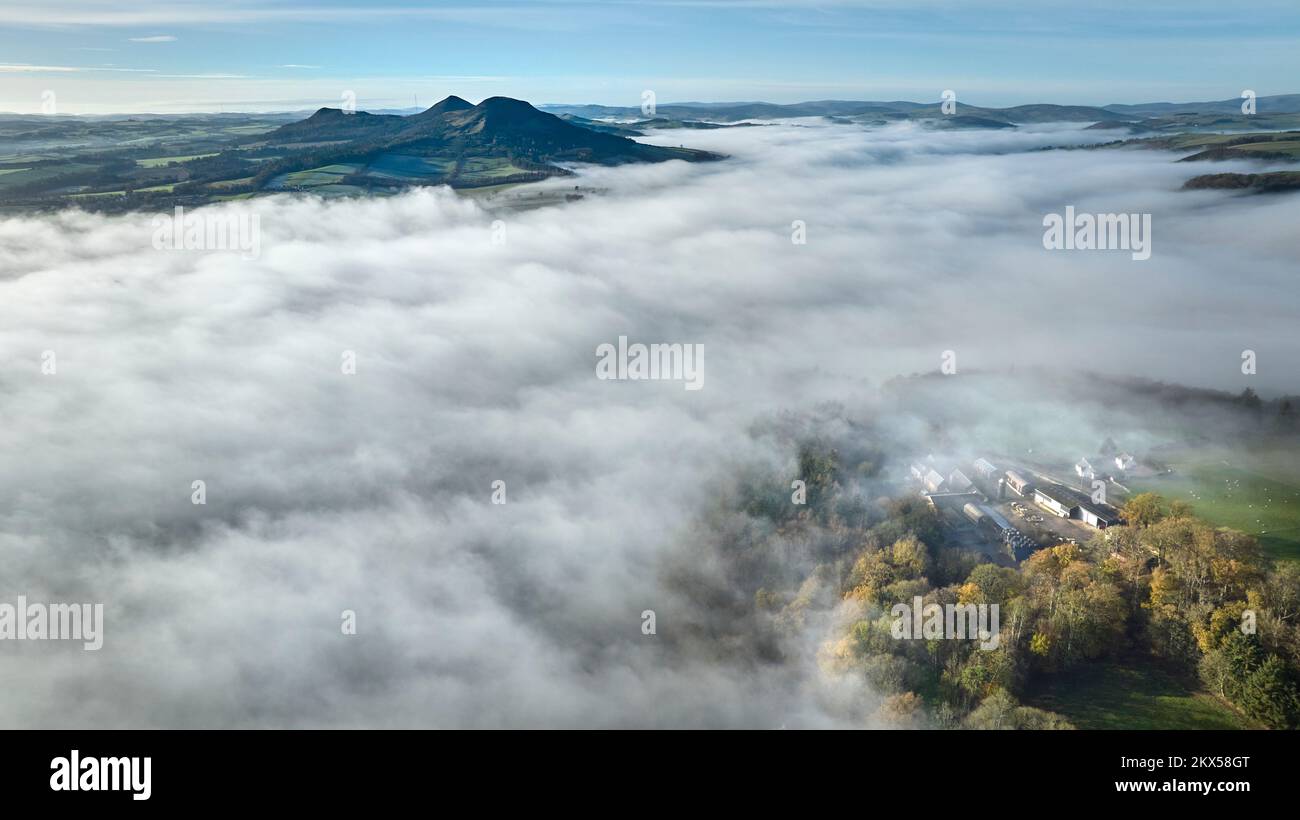 Aerial view of a cloud inversion around the Eildons and the River Tweed ...