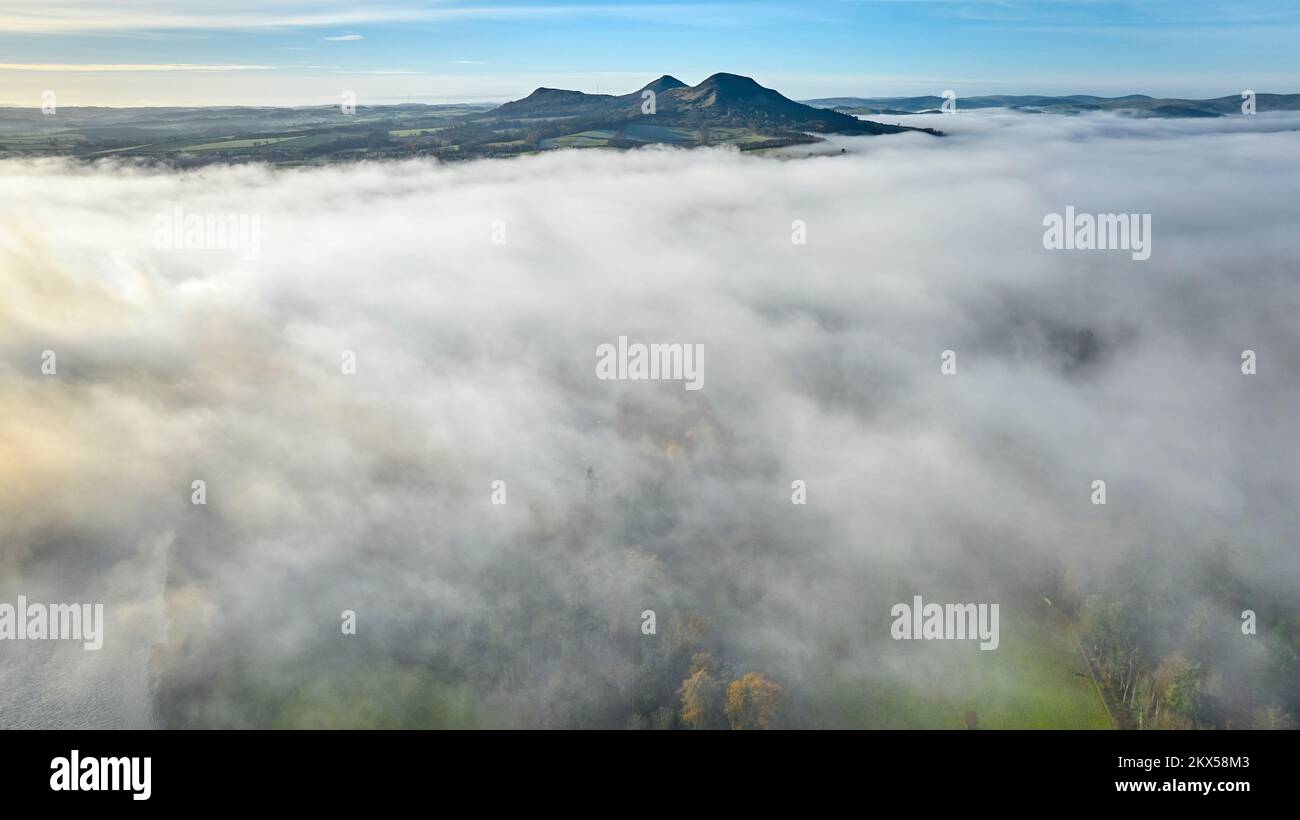 Aerial view of a cloud inversion around the Eildons and the River Tweed ...