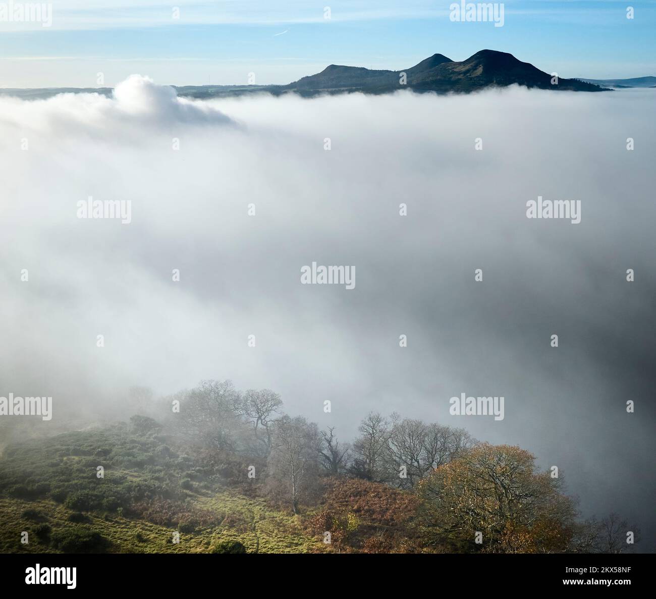 Aerial view of a cloud inversion around the Eildons and the River Tweed ...