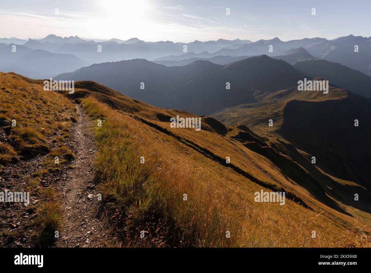 Cold sunlight and red slopes in autumn in the alpine mountains Stock ...
