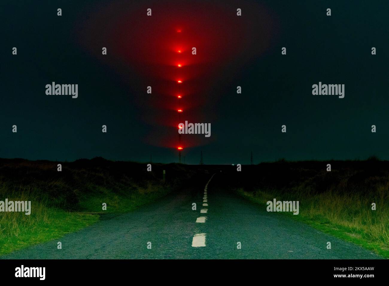 The Winter Hill radio and TV transmitter at night time, casting an ...