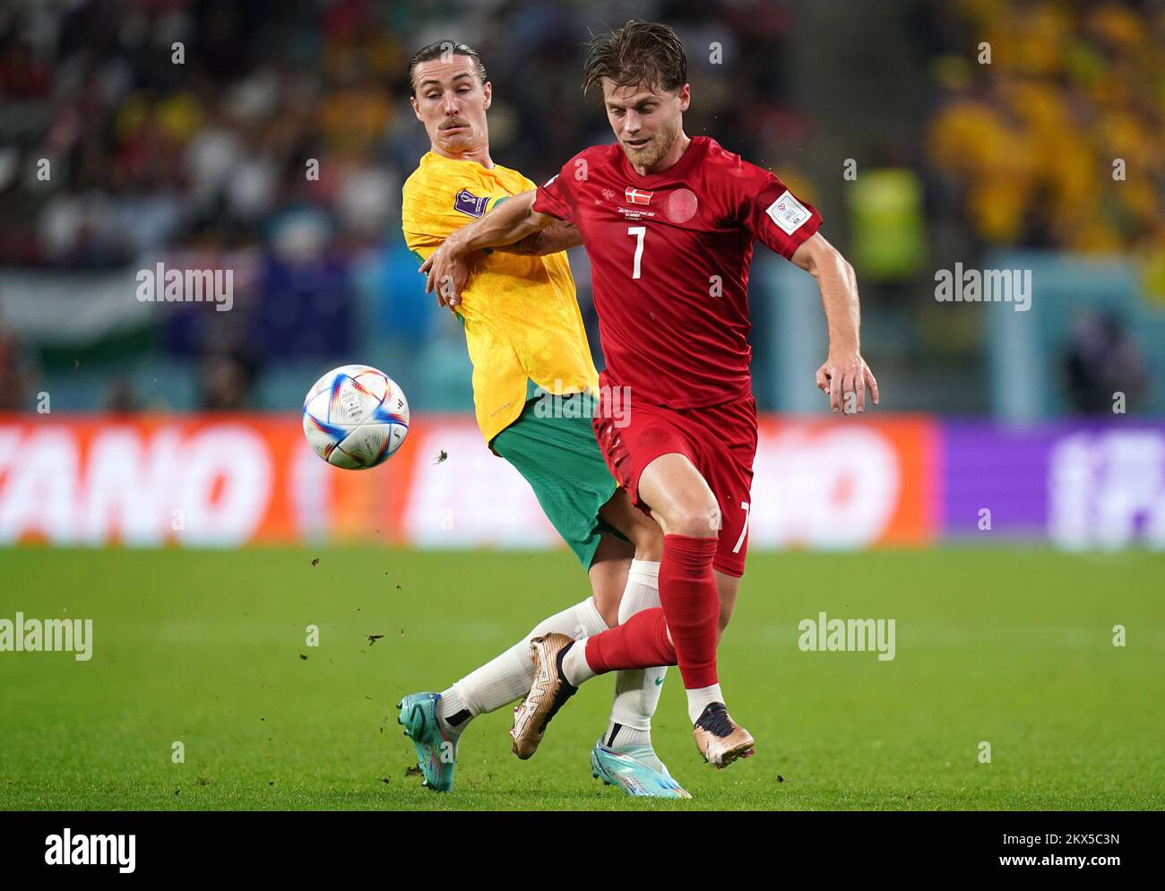 Australia's Jackson Irvine (left) and Denmark's Mathias Jensen battle ...