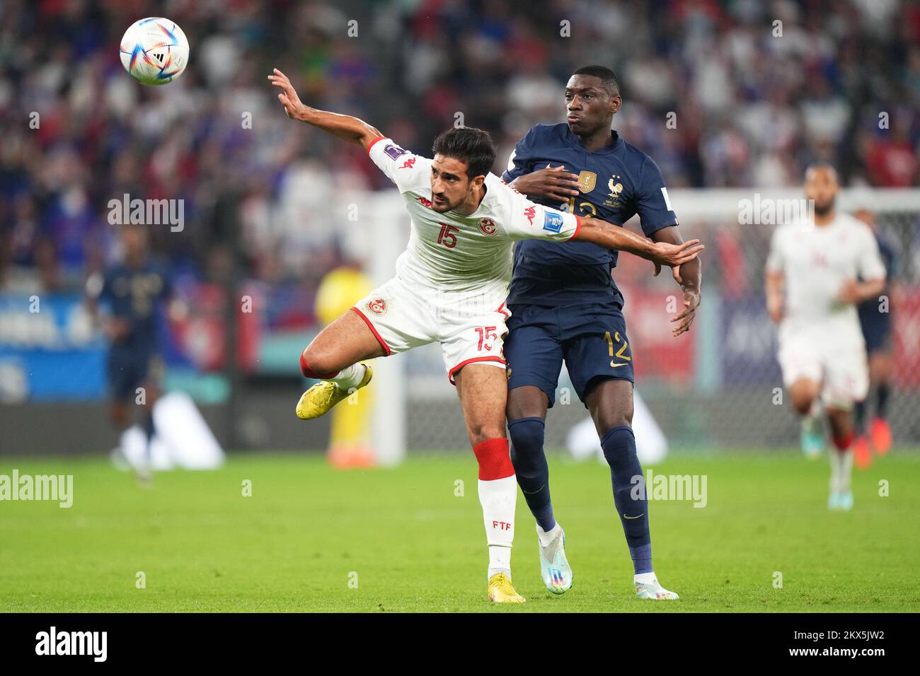 Doha, Qatar. 30/11/2022, Muani of France and Mohamed Ali Ben Romdhane of Tunisia during the FIFA ...