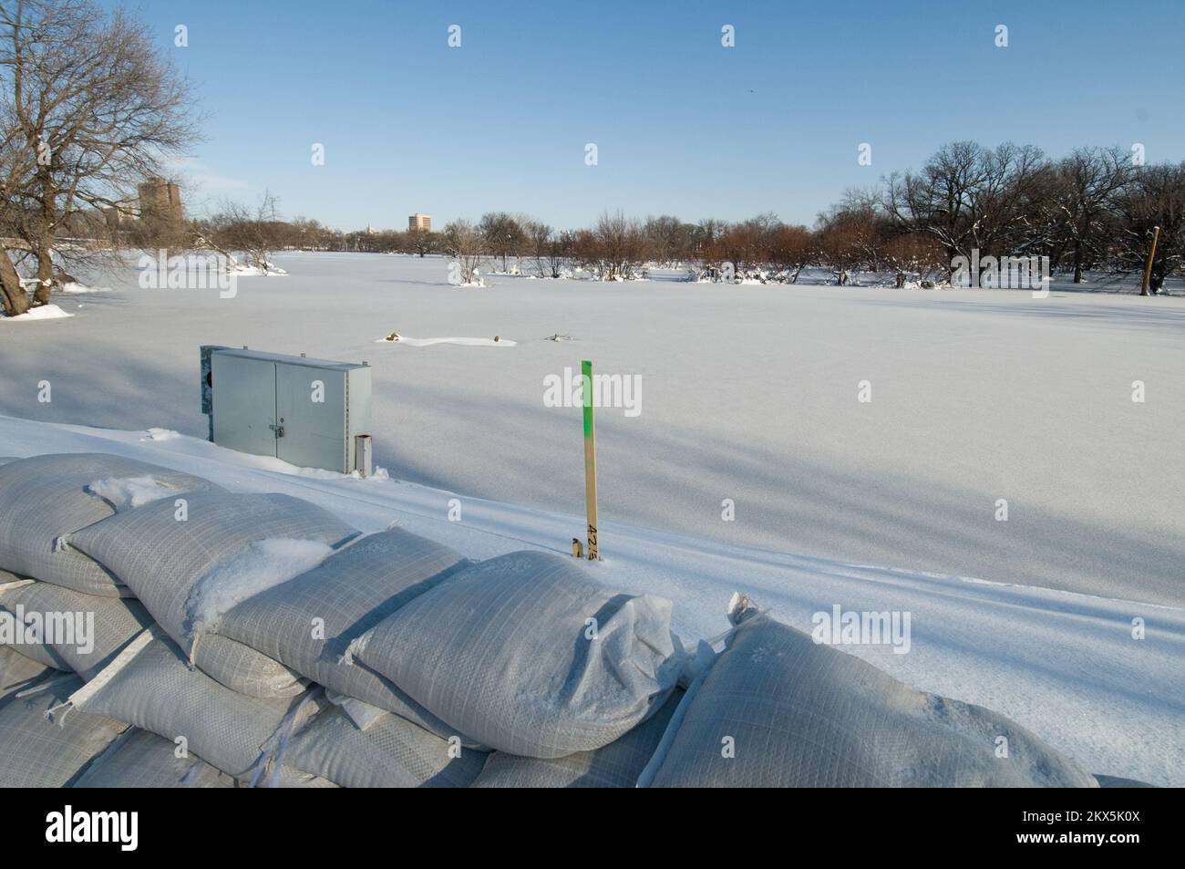 Frozen sandbags stand ready against frozen Red River in MN. Minnesota ...