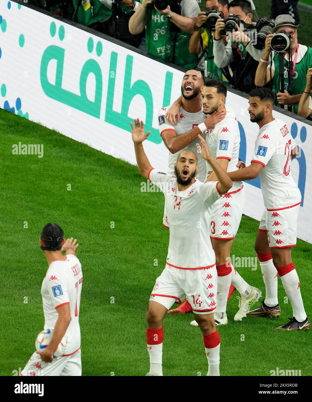 Al Rayyan, Qatar. 30th Nov, 2022. Nader Ghandri (top L) of Tunisia ...