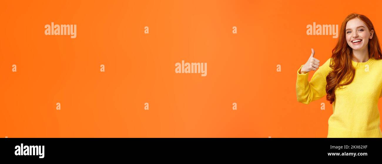 Holidays, gestures, people concept. Cheerful cute redhead girl smiling ...