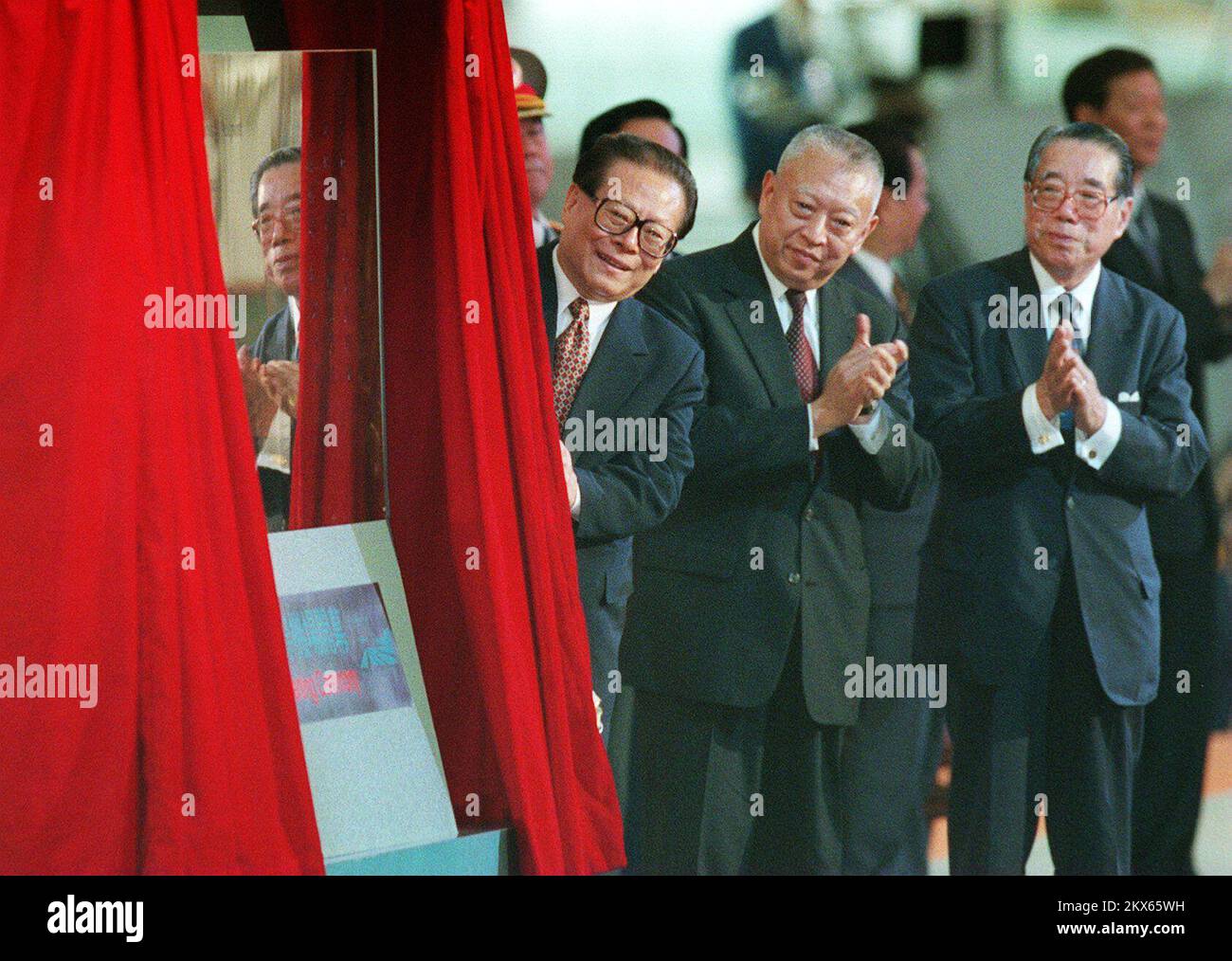 President Jiang Zemin unveils a plaque marking the opening of the ...