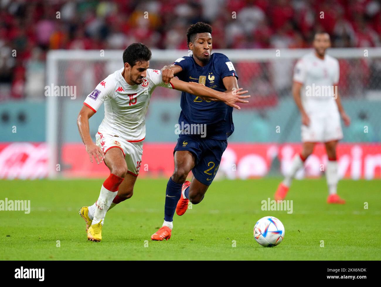 Tunisia's Mohamed Ali Ben Romdhane (left) and France's Kingsley Coman ...
