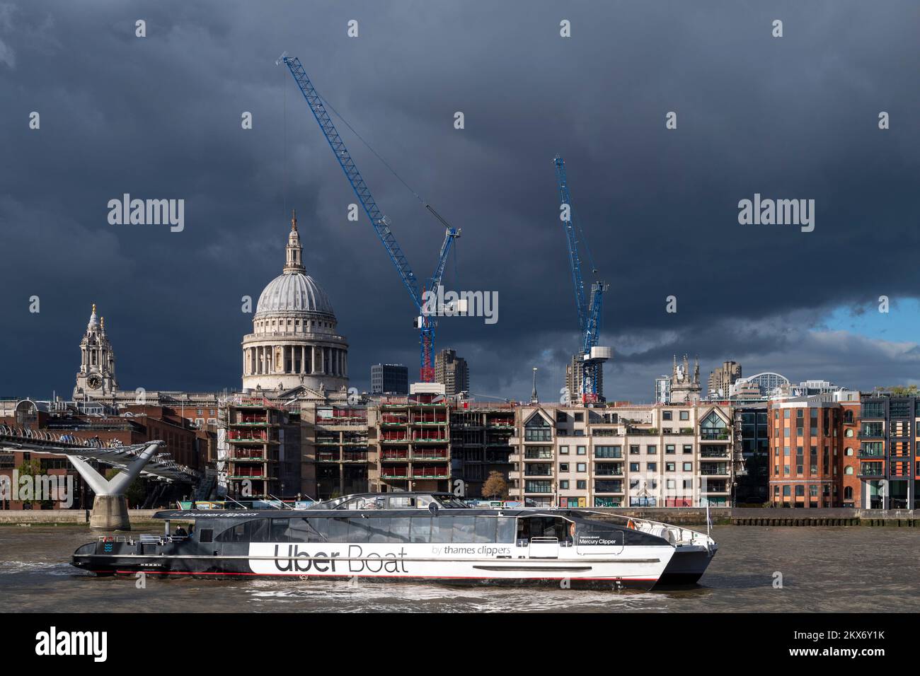 An Uber Boat by Thames Clippers, river bus coming under the Millennium ...